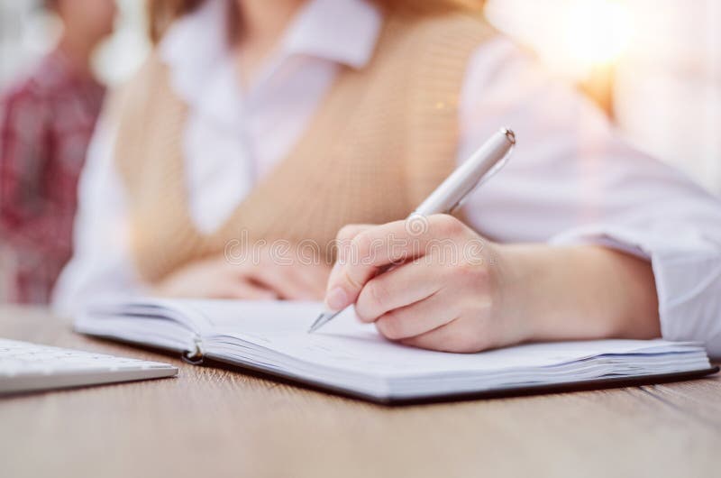 Planning Working Schedule Writing in Notebook while Sitting at Working ...