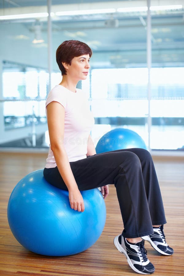 Planning Workout Routine. Full Length of Woman Sitting on Exercise Ball ...