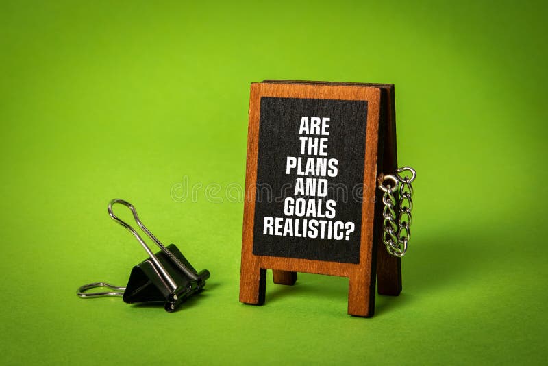 Plans and Goals Concept. Miniature Chalkboard with Text on a Green ...