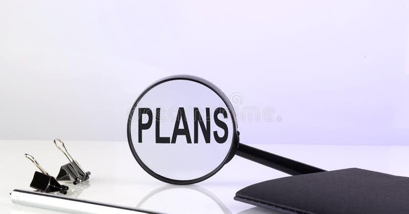 PLANS Text Concept. Magnifier Glass with Text with Notebook and Pen ...