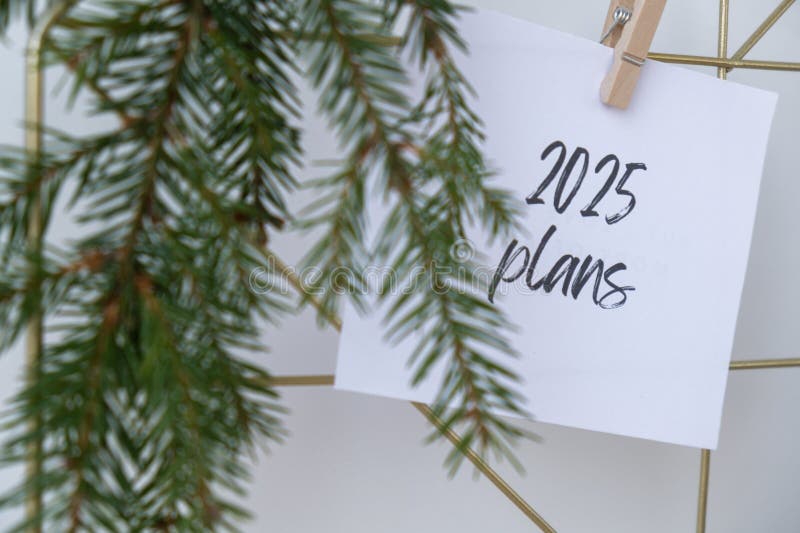 2025 PLANS Text on White Paper Note on Vision Board with Christmas ... 2025 PLANS Text on White Paper Note on Vision Board with Christmas ...