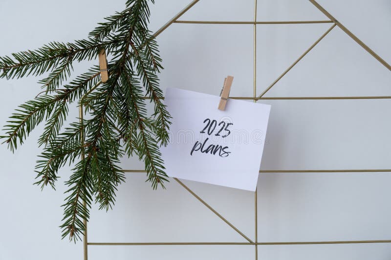 2025 PLANS Text on White Paper Note on Vision Board with Christmas ... 2025 PLANS Text on White Paper Note on Vision Board with Christmas ...