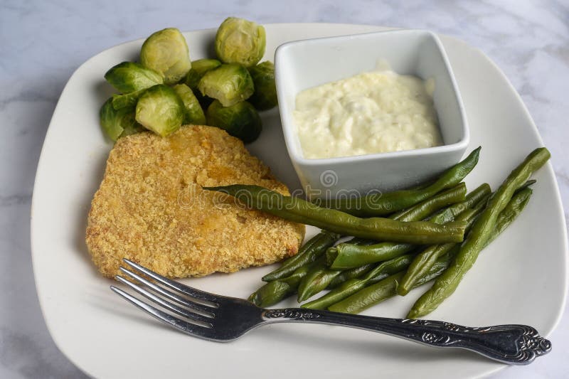 Plant Based Fish Fillet with Green Beans and Brussel Sprouts Stock ...