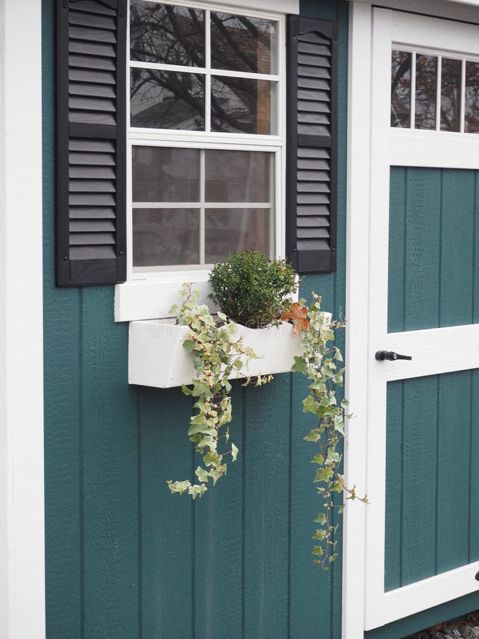 The Planter is Under the Window. Stock Image - Image of planter, green ...
