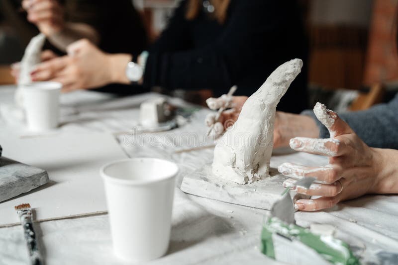 Plaster Casting Class. Women`s Hands Work with the Form Stock Image ...