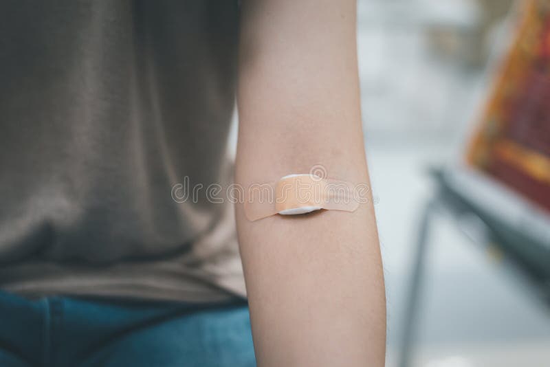 Plaster and Cotton on Woman Arm after Blood Testing or Blood Donation ...