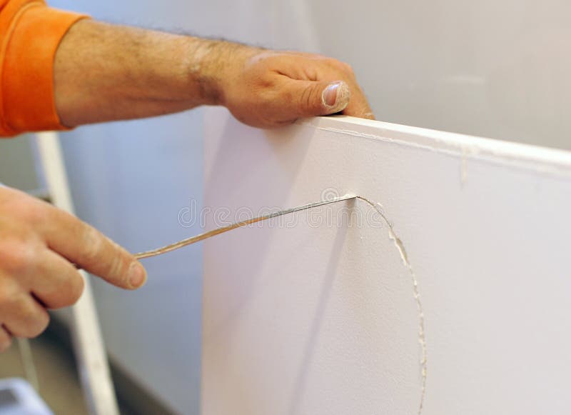 Mason Making An Undercut For Electrical Conduits During The Renovation ...