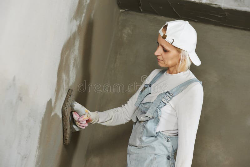Female plasterer portrait stock photo. Image of plasterer - 44645324
