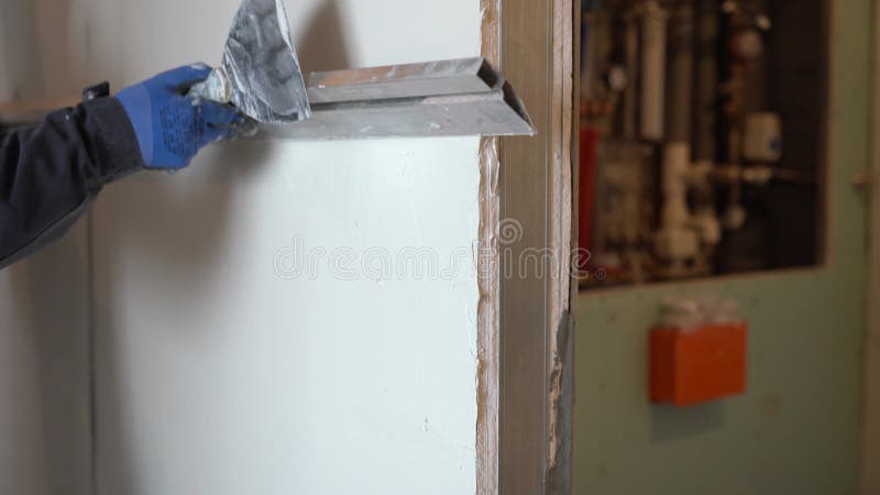 The Plasterer Levels the Plaster Layer on the Wall Using the Rules of ...