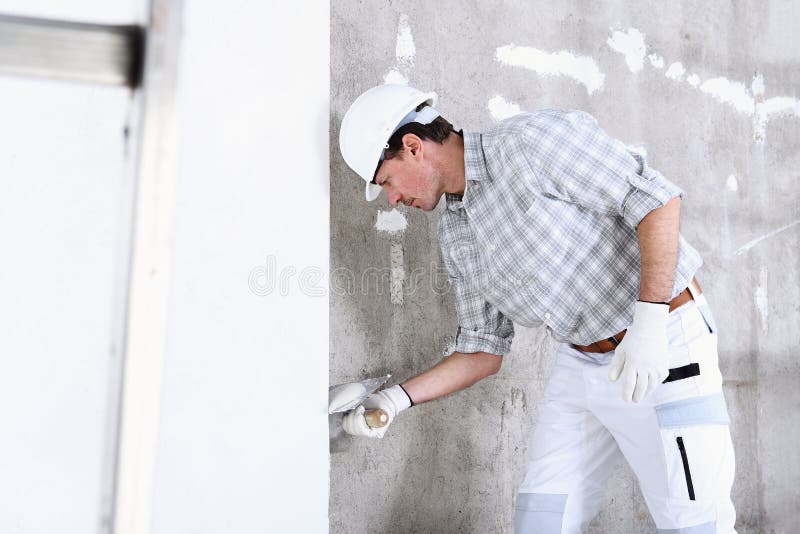 Plasterer Man at Work with Trowel Plastering the Wall of Interior ...