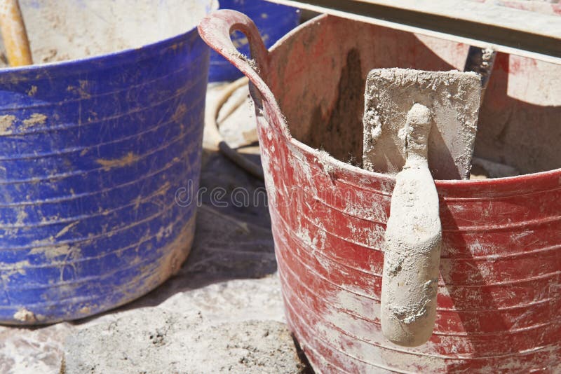 Plasterer`s Tools in Bucket Full of Wet Plaster Stock Image - Image of ...