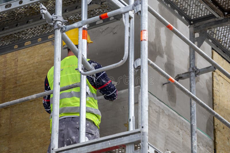 Plasterer on Scaffold Working Stock Photo - Image of caucasian ...
