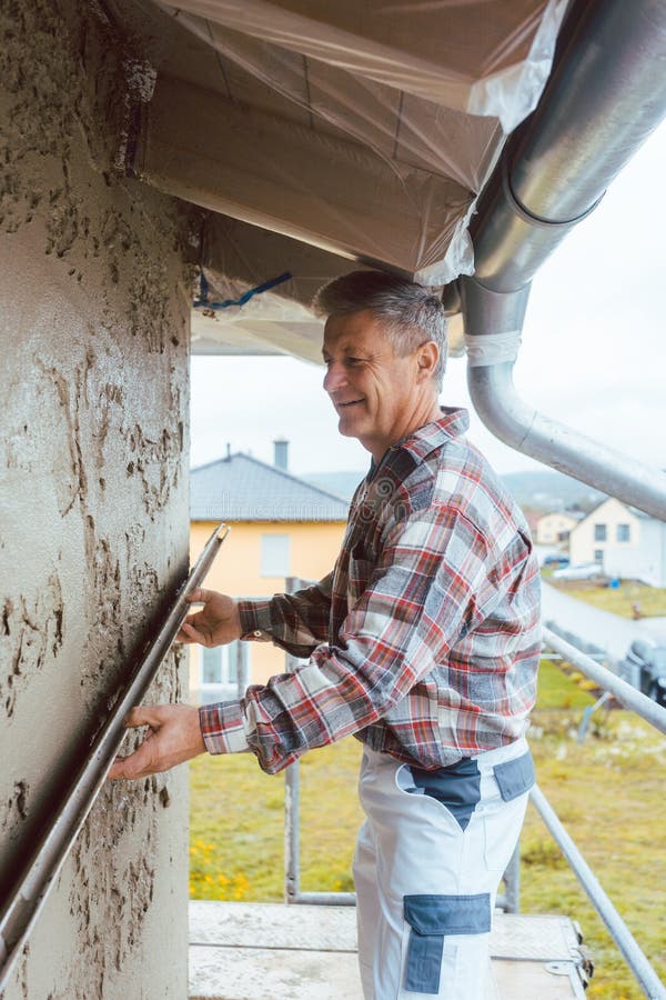 Plasterer Smoothing Plaster Mortar on Ceiling with Screeder Stock Image ...
