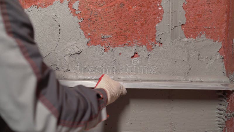 Plasterer Smoothing Plaster on Interior Wall with Construction Ruler ...