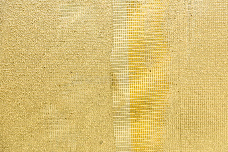 Plastering a New Modern House Wall with Plastic Grid on a PVC ...