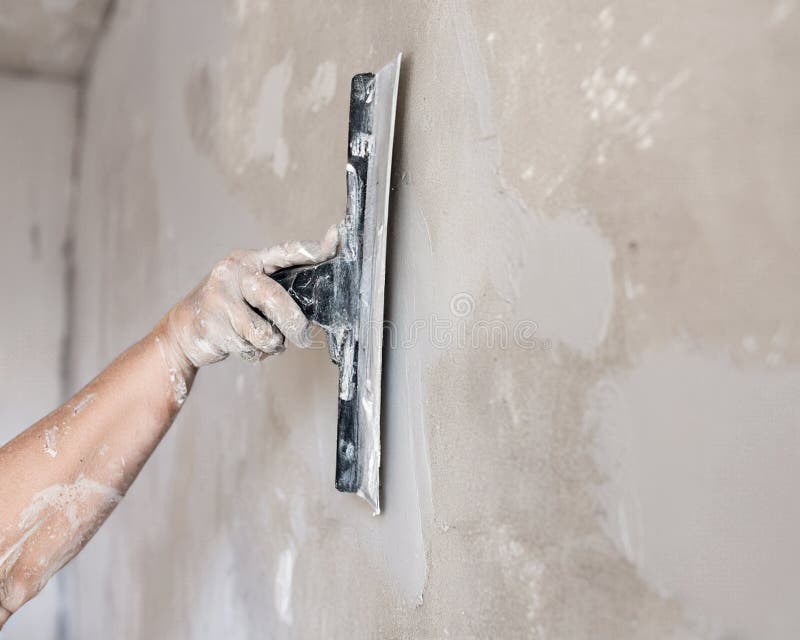 Plastering a Wall with Plaster in a House with a Plaster Knife Stock ...