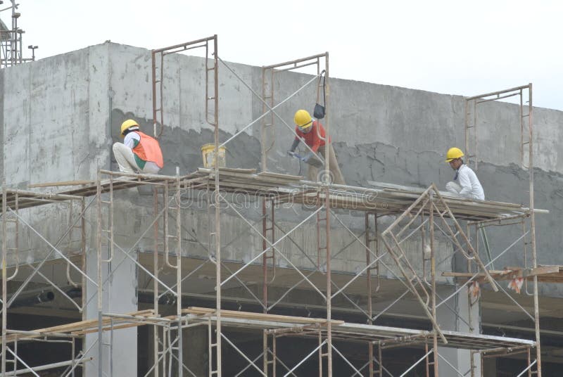 Plastering Work by Construction Workers Using the Cement Plaster ...