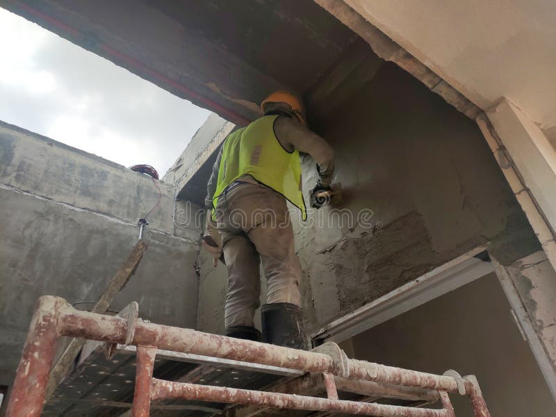 Plastering Work by Construction Workers Using the Cement Plaster ...