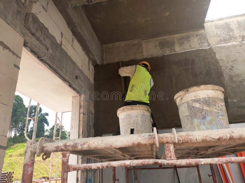 Plastering Work by Construction Workers Using the Cement Plaster ...