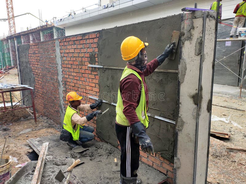Plastering Work by Construction Workers Using the Cement Plaster ...
