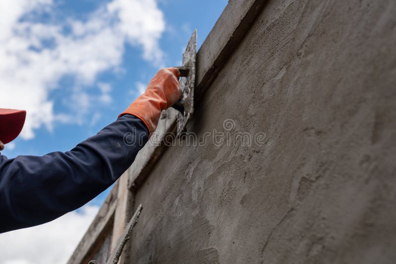 Plastering Worker Plastering Cement on the Construction Site Stock ...