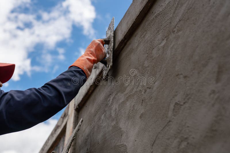Plastering Worker Plastering Cement on the Construction Site Stock ...