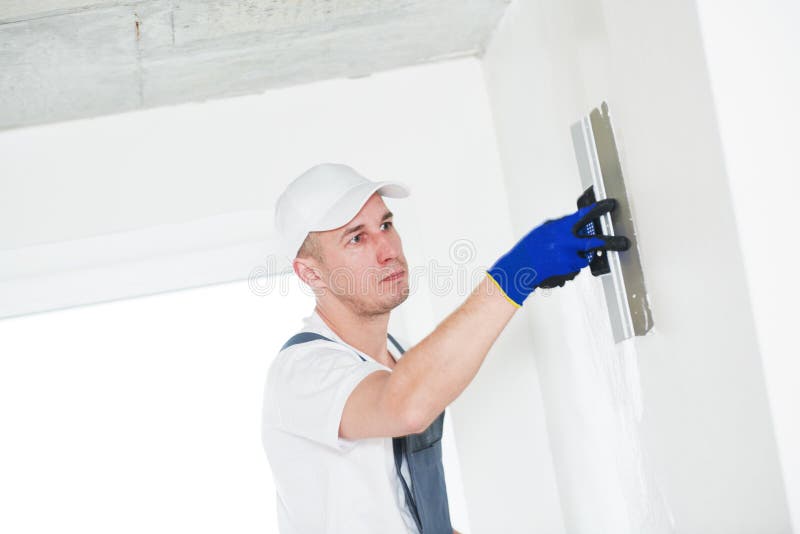 Plastering. Worker Spackling a Wall with Putty Stock Photo - Image of ...
