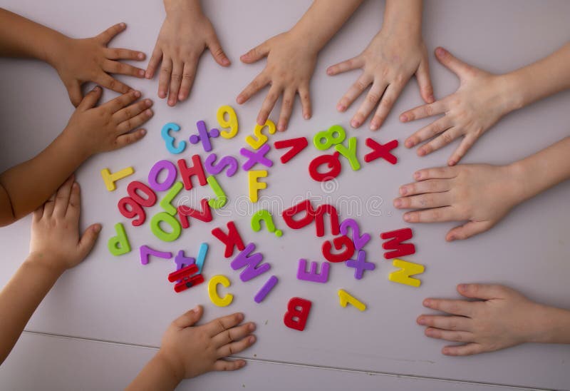 Plastic Alphabet Letters with Kids Hands, Top View Stock Image - Image ...