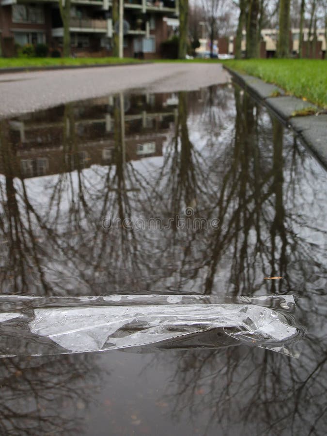 Plastic Bag Discarded on the Street in a Suburb Stock Photo - Image of ...