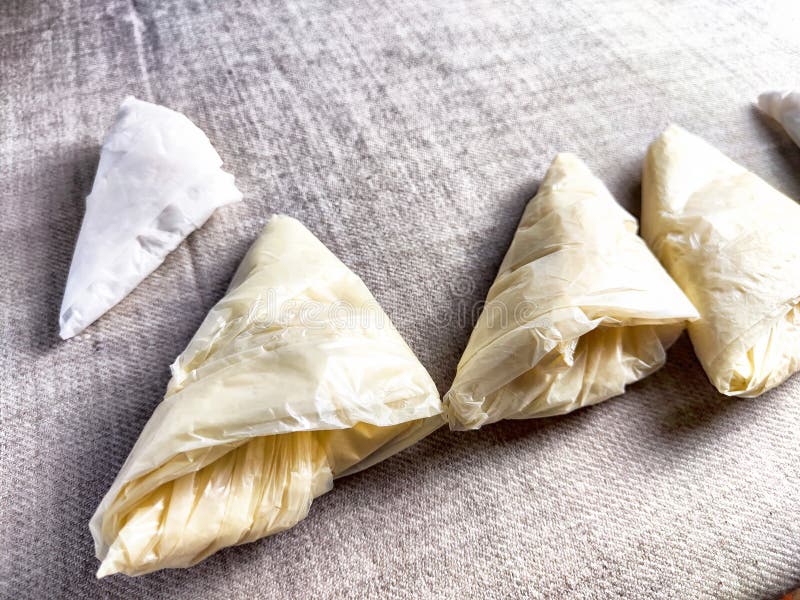 Plastic Bag Folded into a Triangle for Storage. Ways of Storing and ...