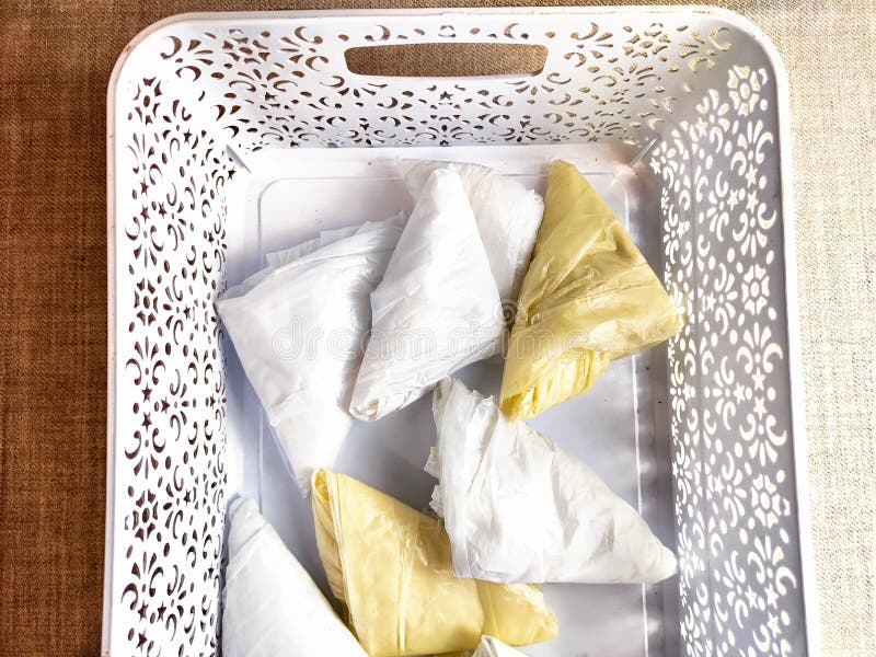 Plastic Bag Folded into a Triangle for Storage. Ways of Storing and ...