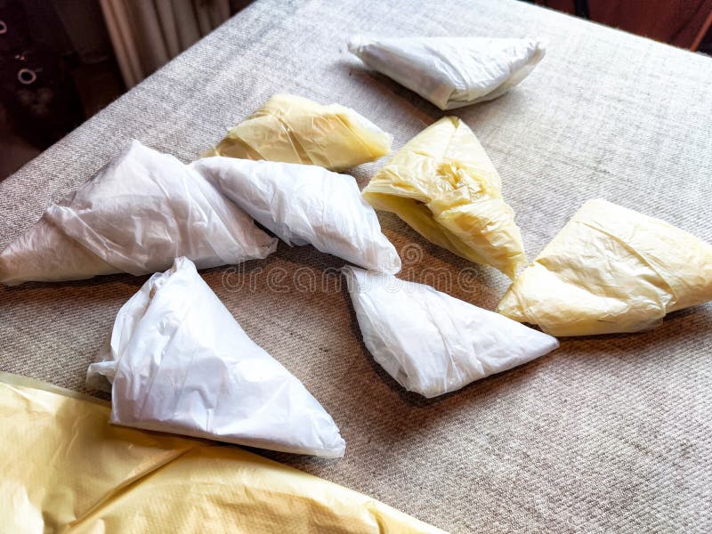 Plastic Bag Folded into a Triangle for Storage. Ways of Storing and ...