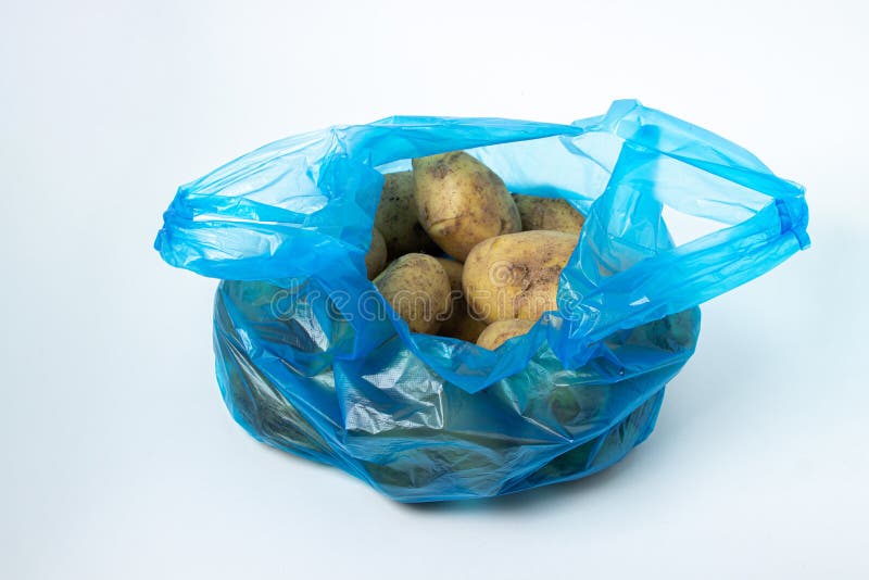 Plastic Bag with Potatoes on a White Background. Blue Package with ...