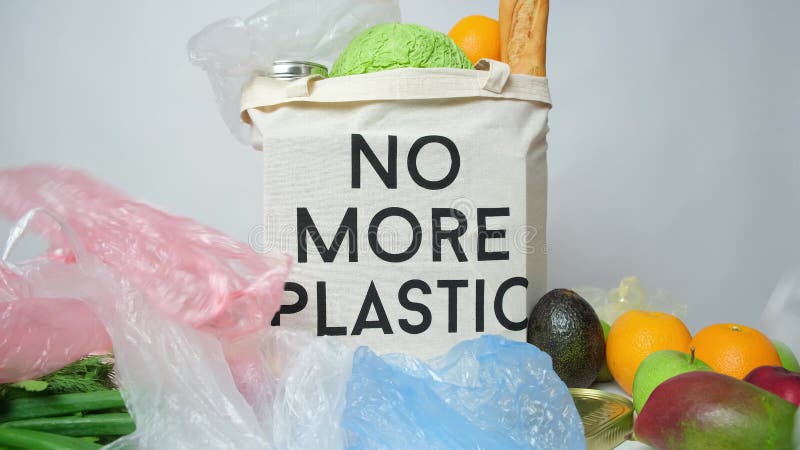 Plastic Bags Fall on a Reusable Fabric Shopping Bag with Text No More ...