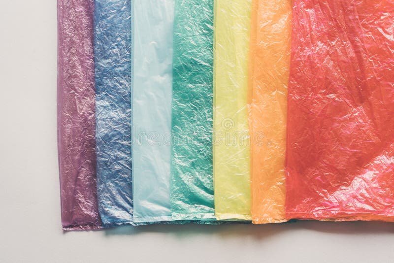 Plastic Bags in a Row by the Colors of the Rainbow on Grey Background ...