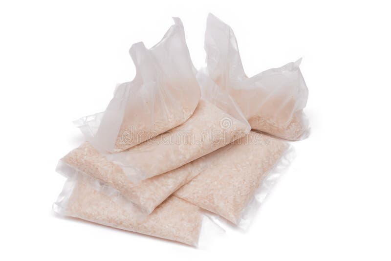 A Plastic Bags of White Long Grain Rice - Isolated on White Stock Image ...