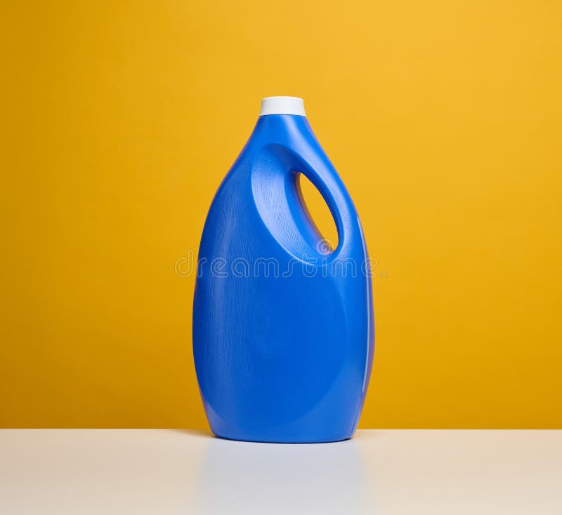 Plastic Blue Bottle with Liquid Detergent Stand on a White Table Stock ...