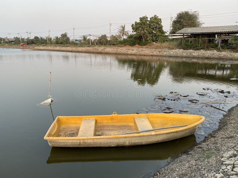 Plastic boat on fish pond stock photo. Image of plastic - 175144032