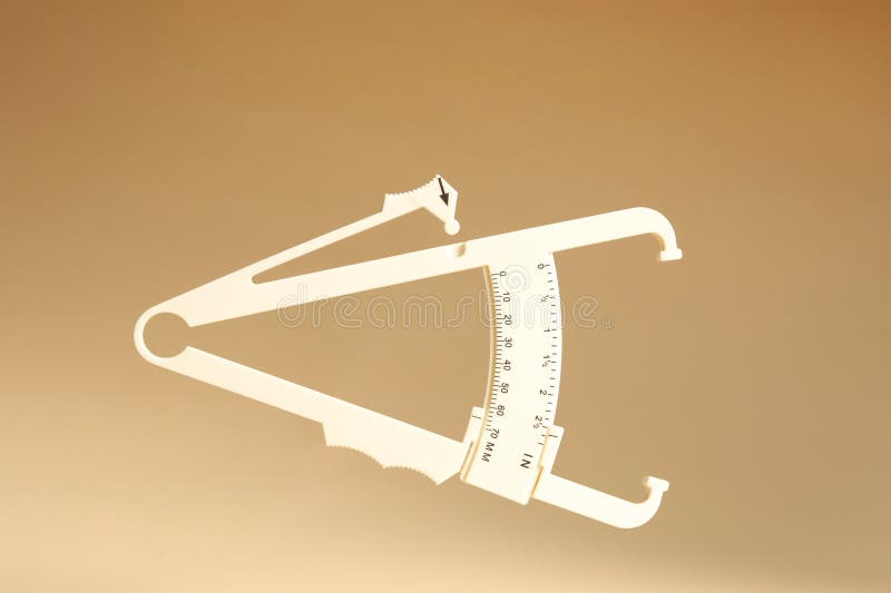Plastic Body Fat Caliper on Beige Background Stock Image - Image of ...
