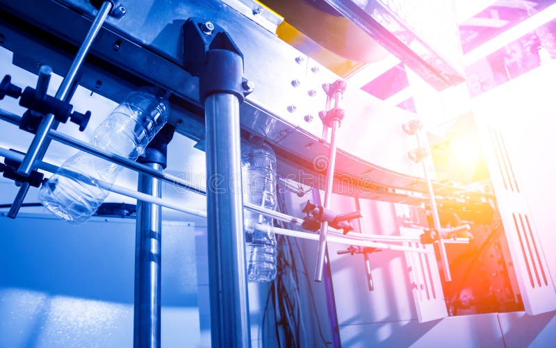 The Plastic Bottle Blowing Machine. PET Preforms for Blowing of Plastic ...