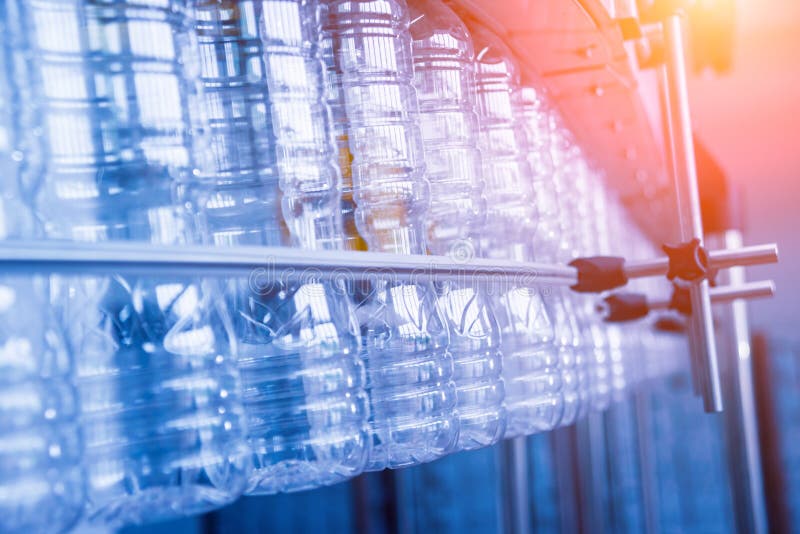 The Plastic Bottle Blowing Machine. PET Preforms for Blowing of Plastic ...