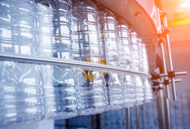 The Plastic Bottle Blowing Machine. PET Preforms for Blowing of Plastic ...