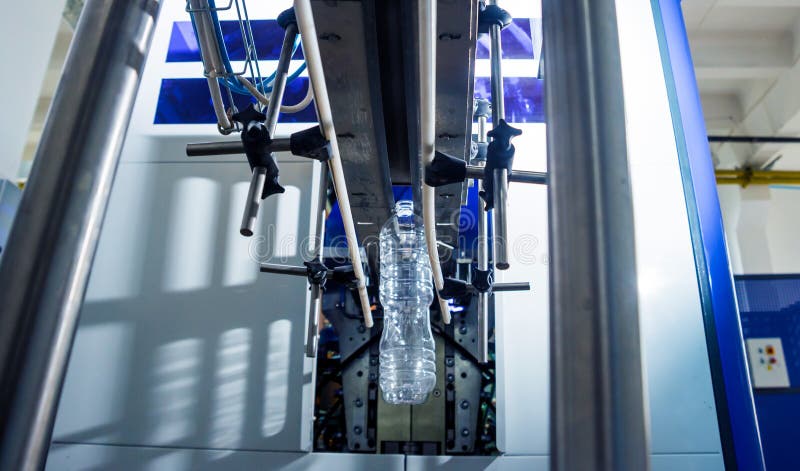 The Plastic Bottle Blowing Machine. PET Preforms for Blowing of Plastic ...