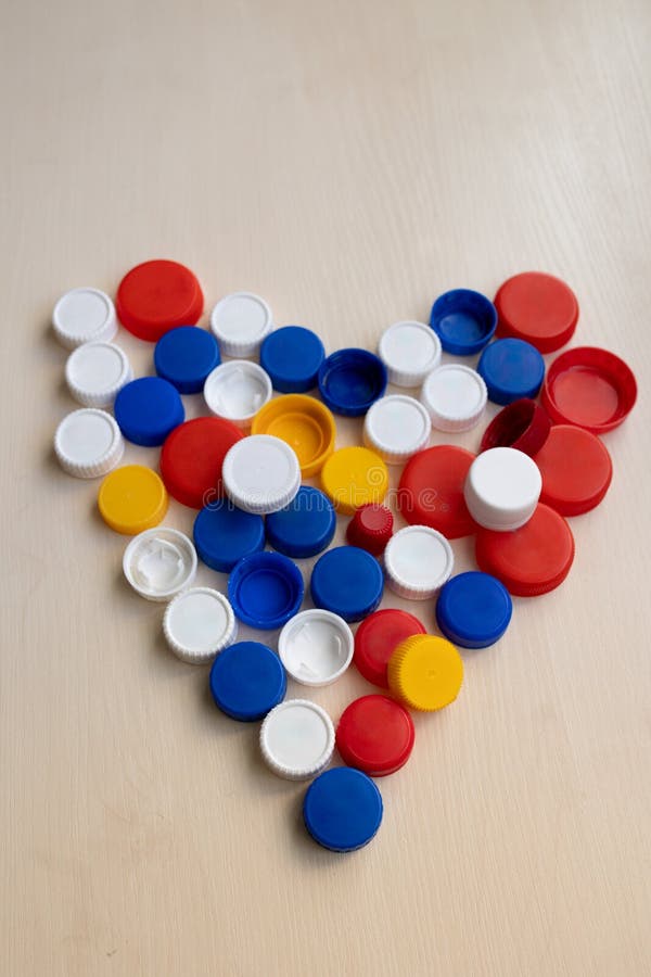Plastic Bottle Caps Background. Cap Material is Recyclable.Remove Lids ...
