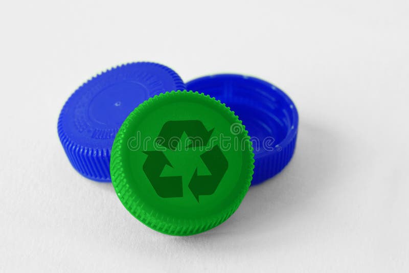 Plastic Bottle Caps with Recycle Symbol on White Background - Concept ...