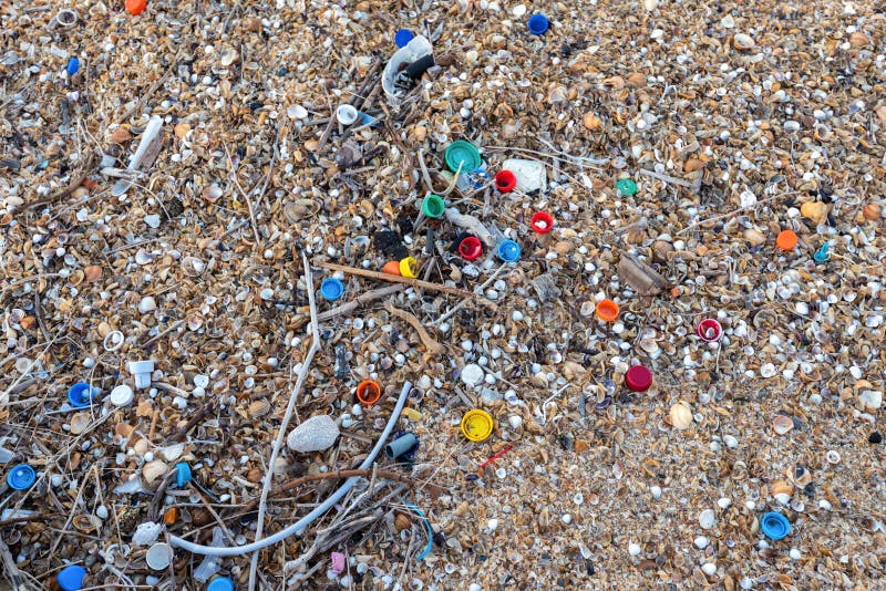 Plastic Bottle Caps Scattered on Shore, Environmental Pollution Stock ...
