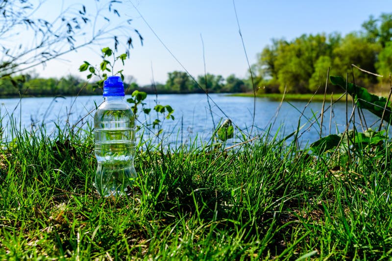 Plastic Bottle with the Clear Water on Wooden Table Stock Photo - Image ...
