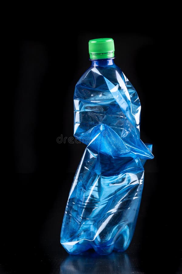 Plastic Bottle on a Dark Table. Plastic Container for Drinking Water ...