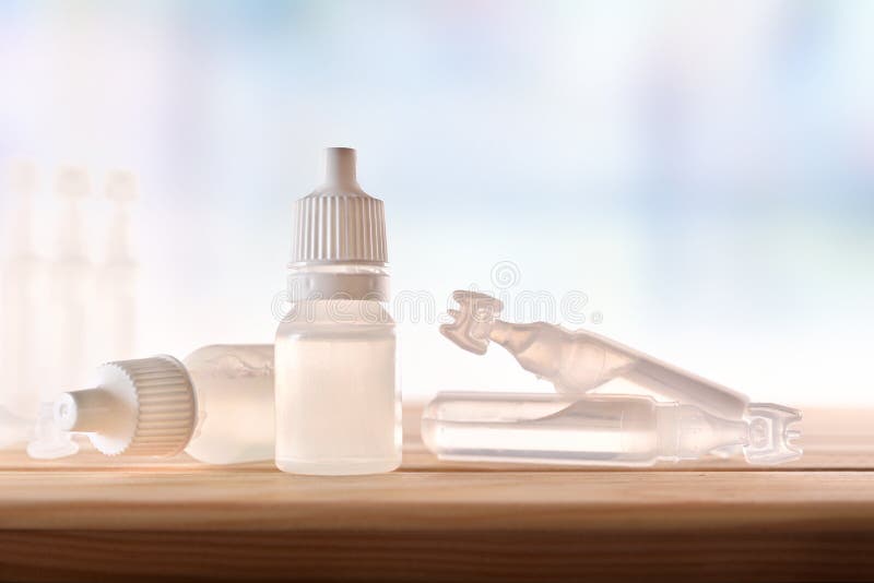 Plastic Bottle and Pipettes with Eye Medication on Table Room Stock ...