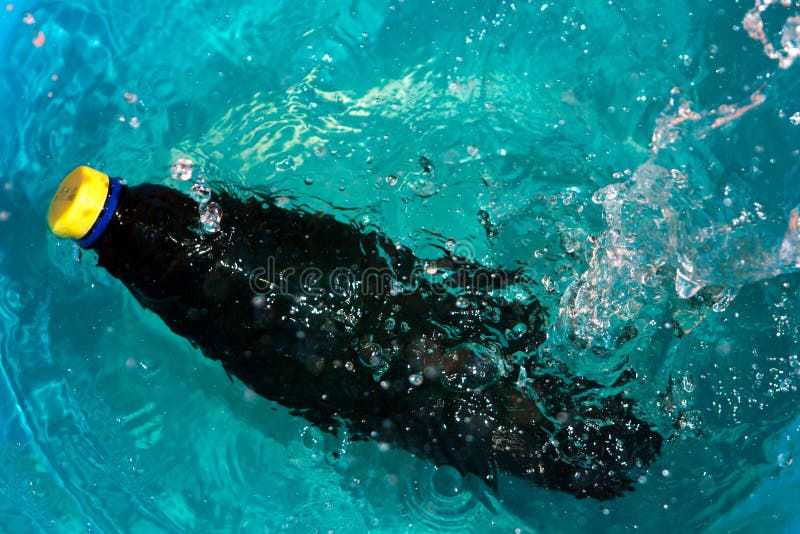 Plastic Bottle Falling into the Water Making Splashes and Spraying ...
